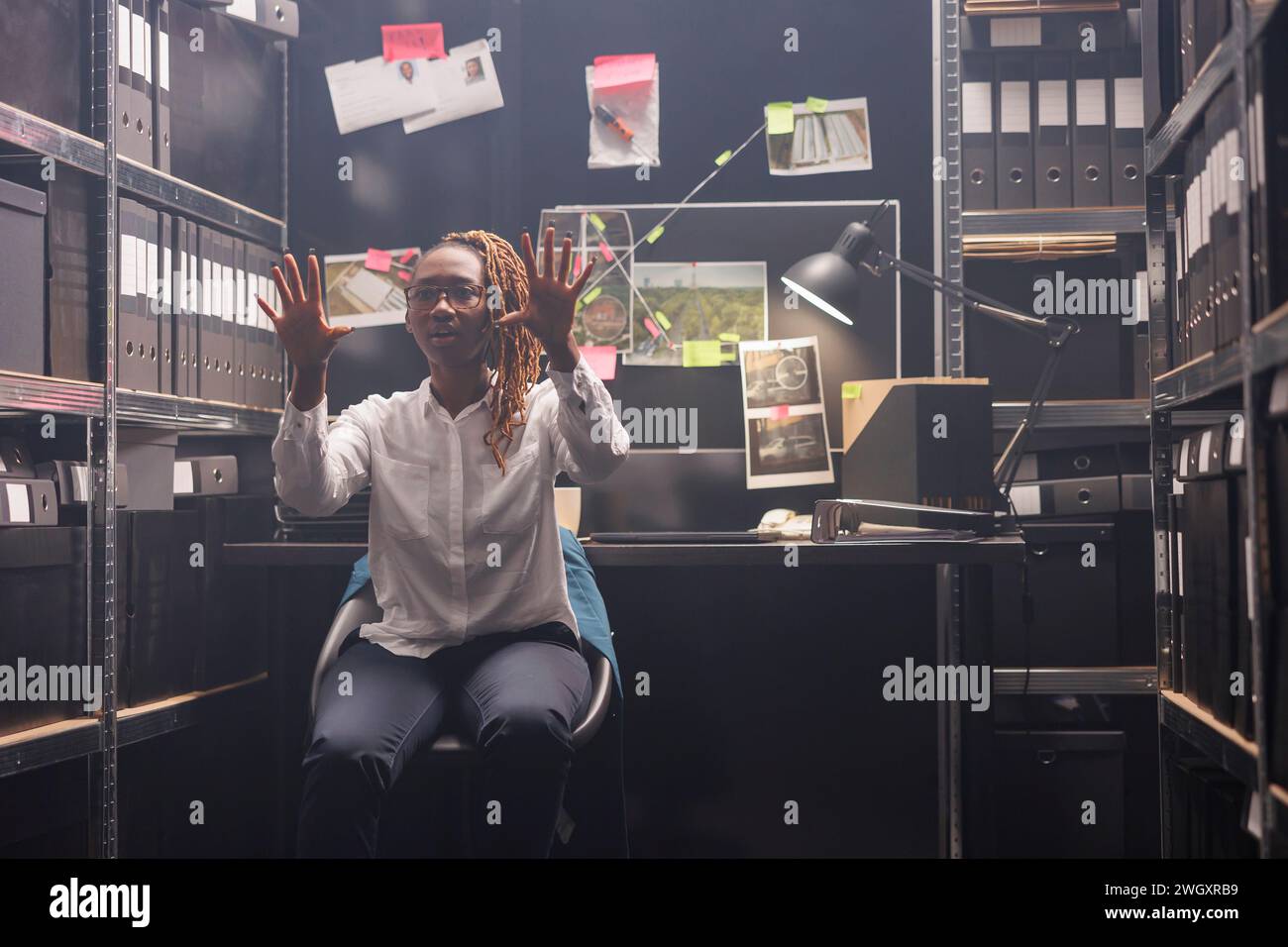 Law enforcement investigator using ar technology to analyze crime scene ...