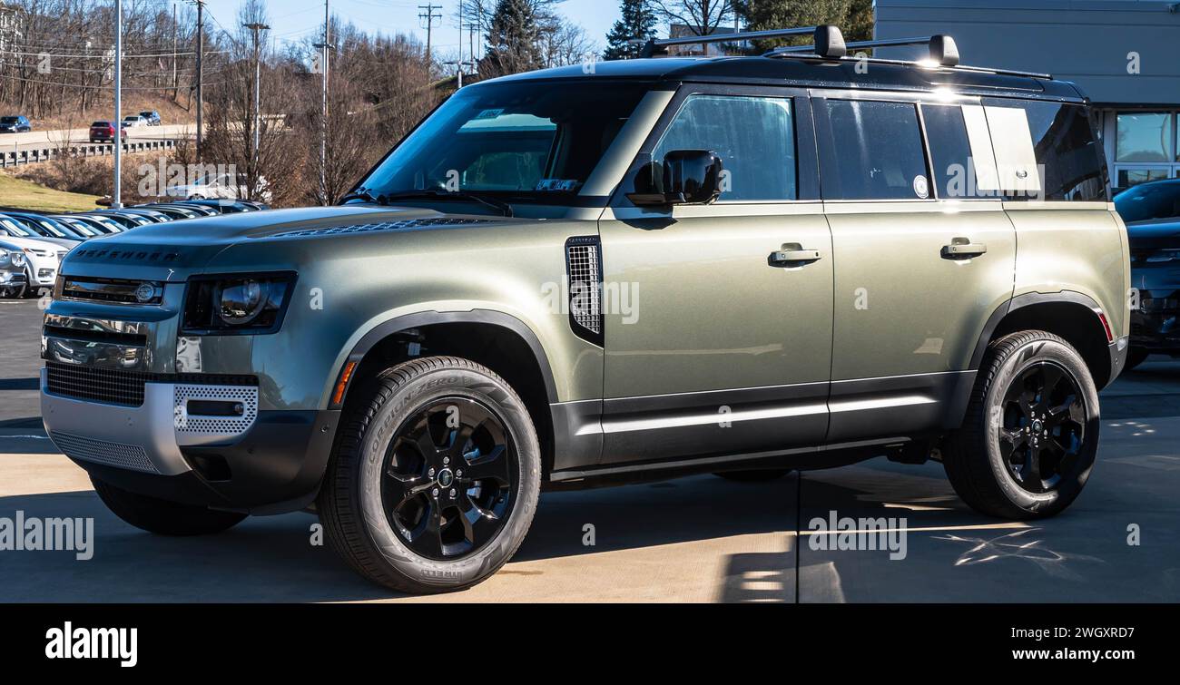 A Land Rover Defender for sale at a dealership Stock Photo - Alamy