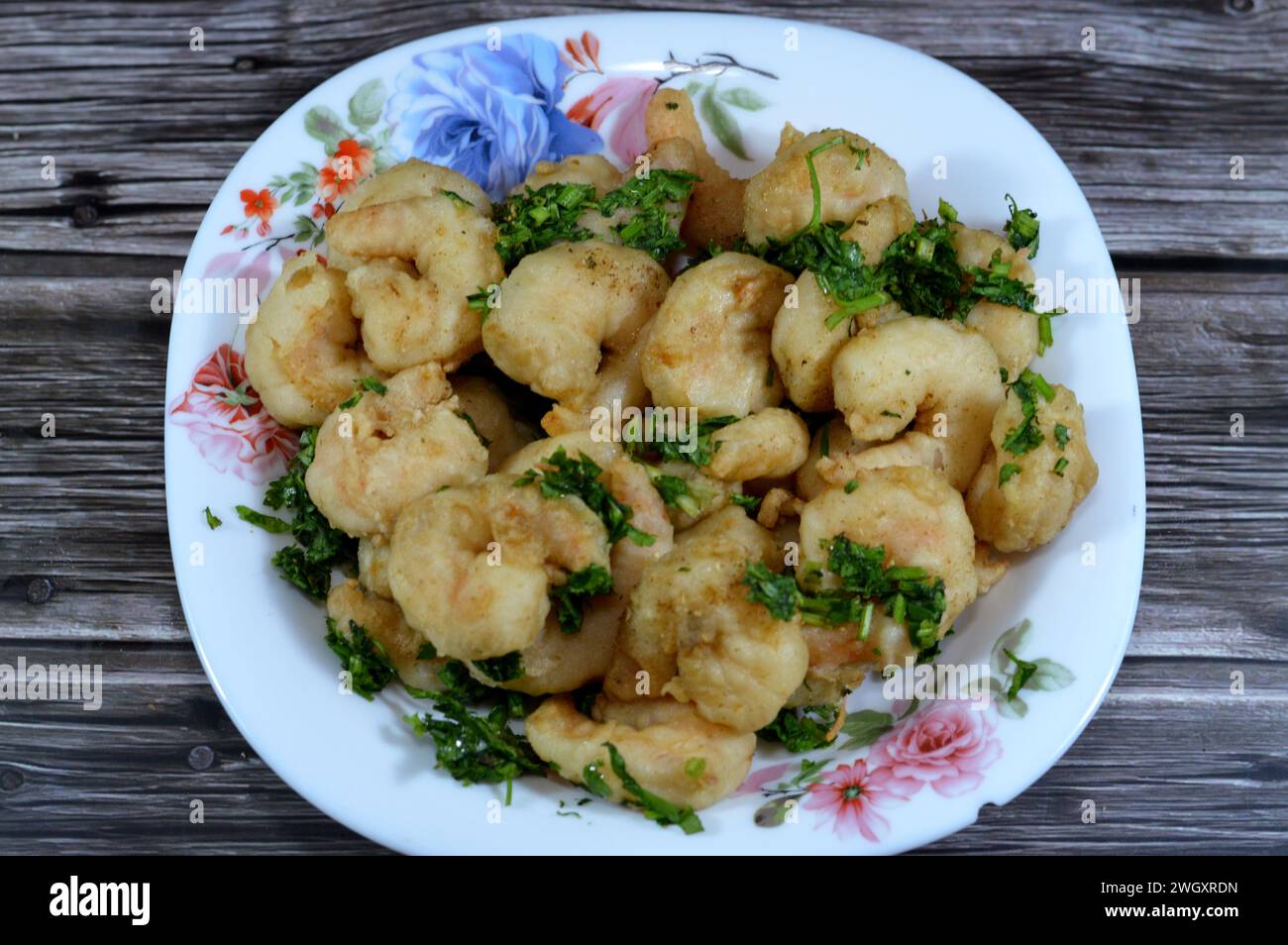 Fried shrimps covered with flour and fried in deep hot oil, shrimps are ...
