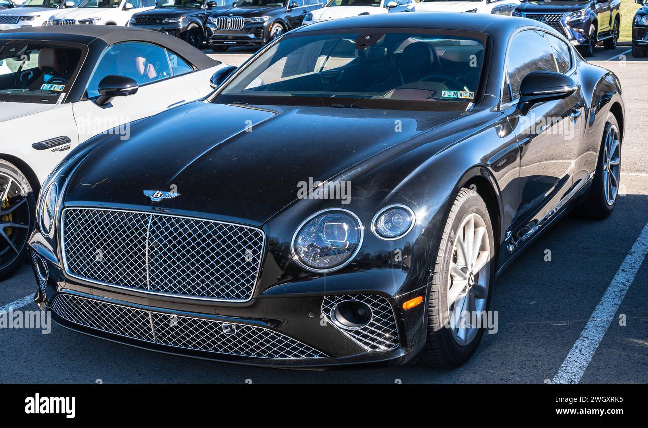 A new, black Bentley Continental GT coupe for sale at a dealership ...