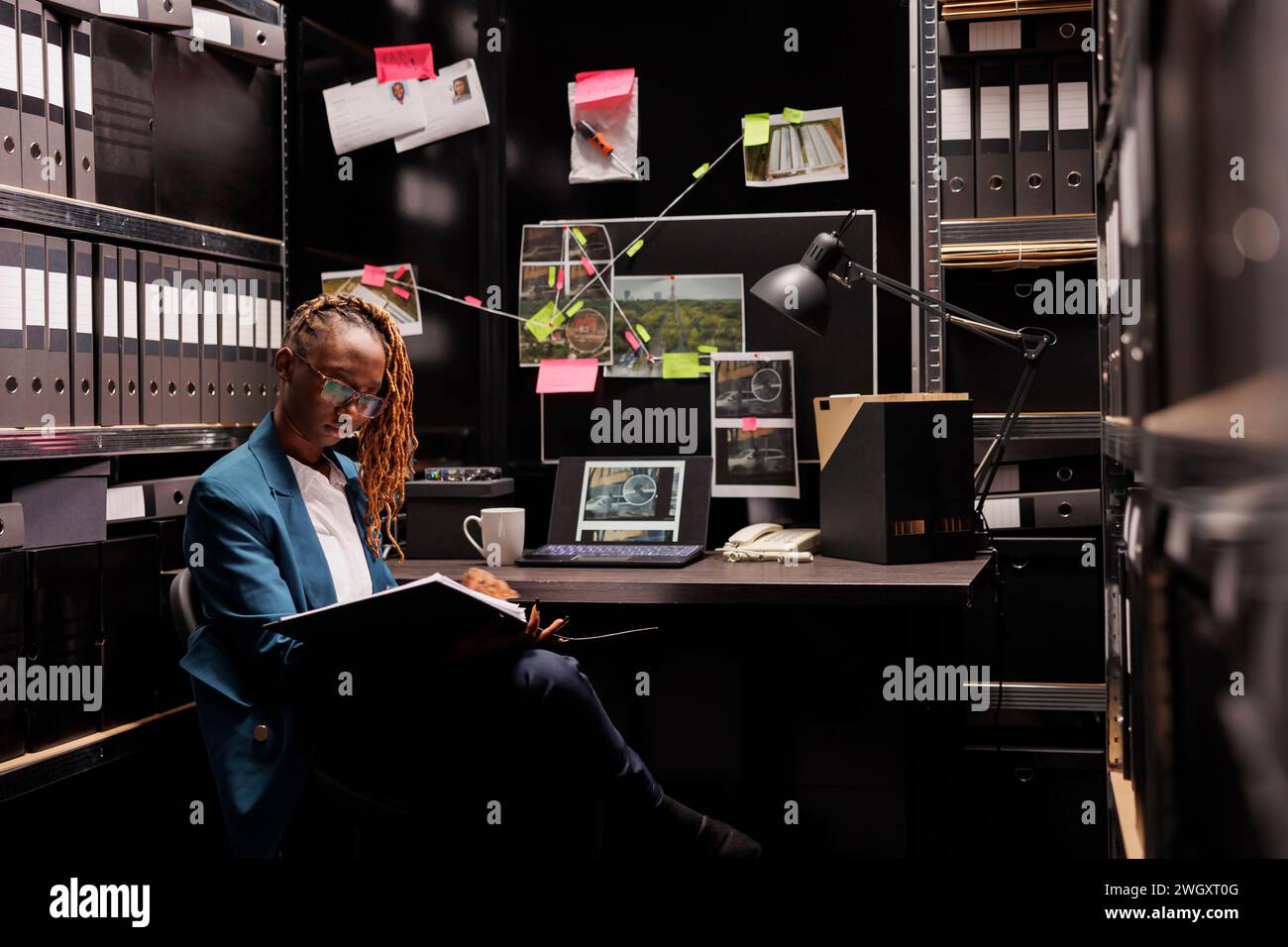 Private detective studying crime case hi-res stock photography and ...