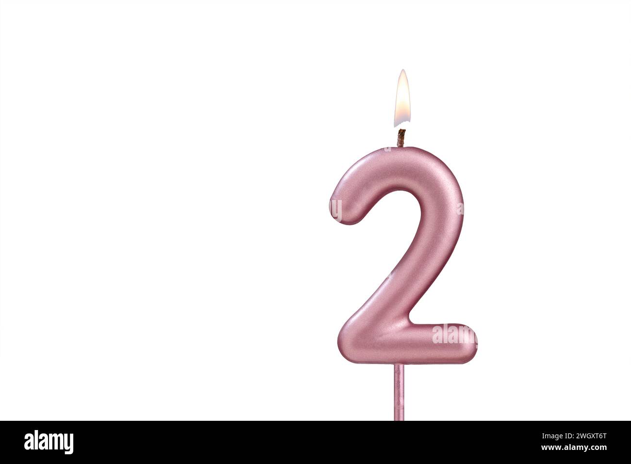 Lit birthday candle - Candle number 2 on white background Stock Photo ...