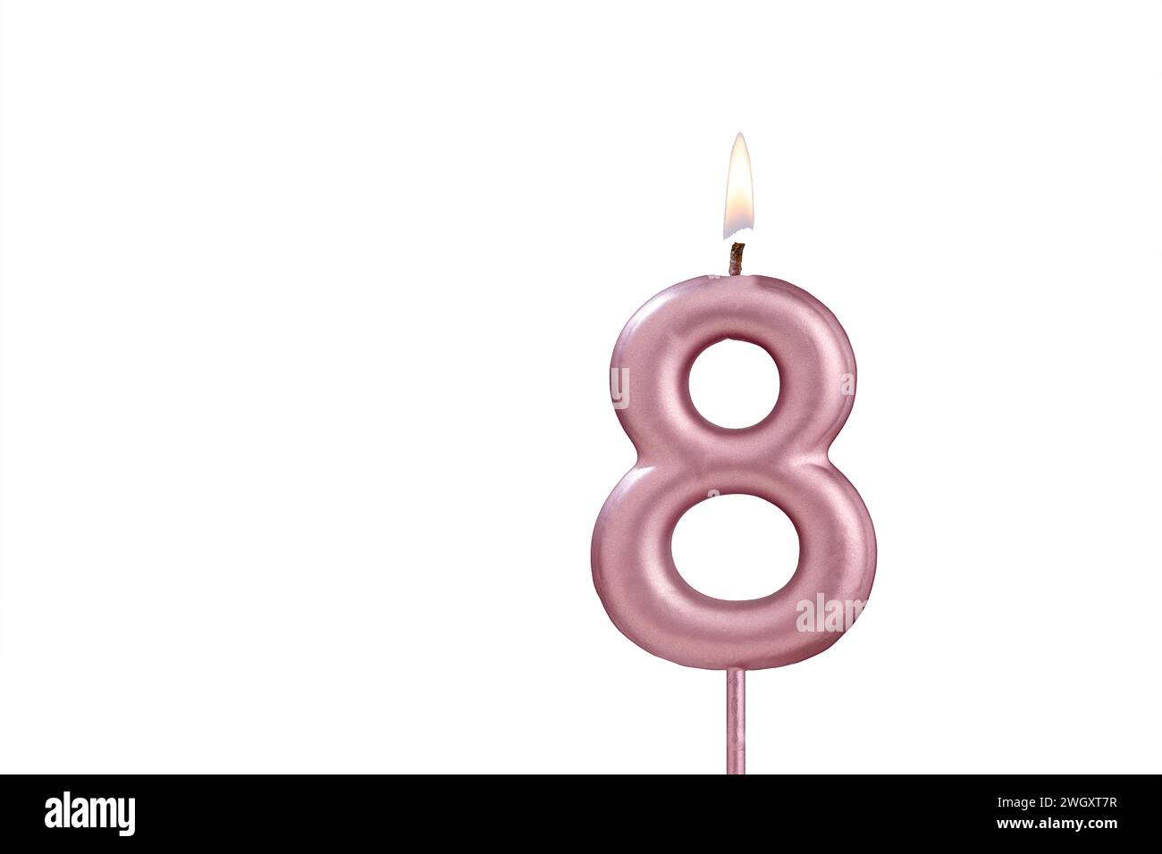 Lit birthday candle - Candle number 8 on white background Stock Photo ...