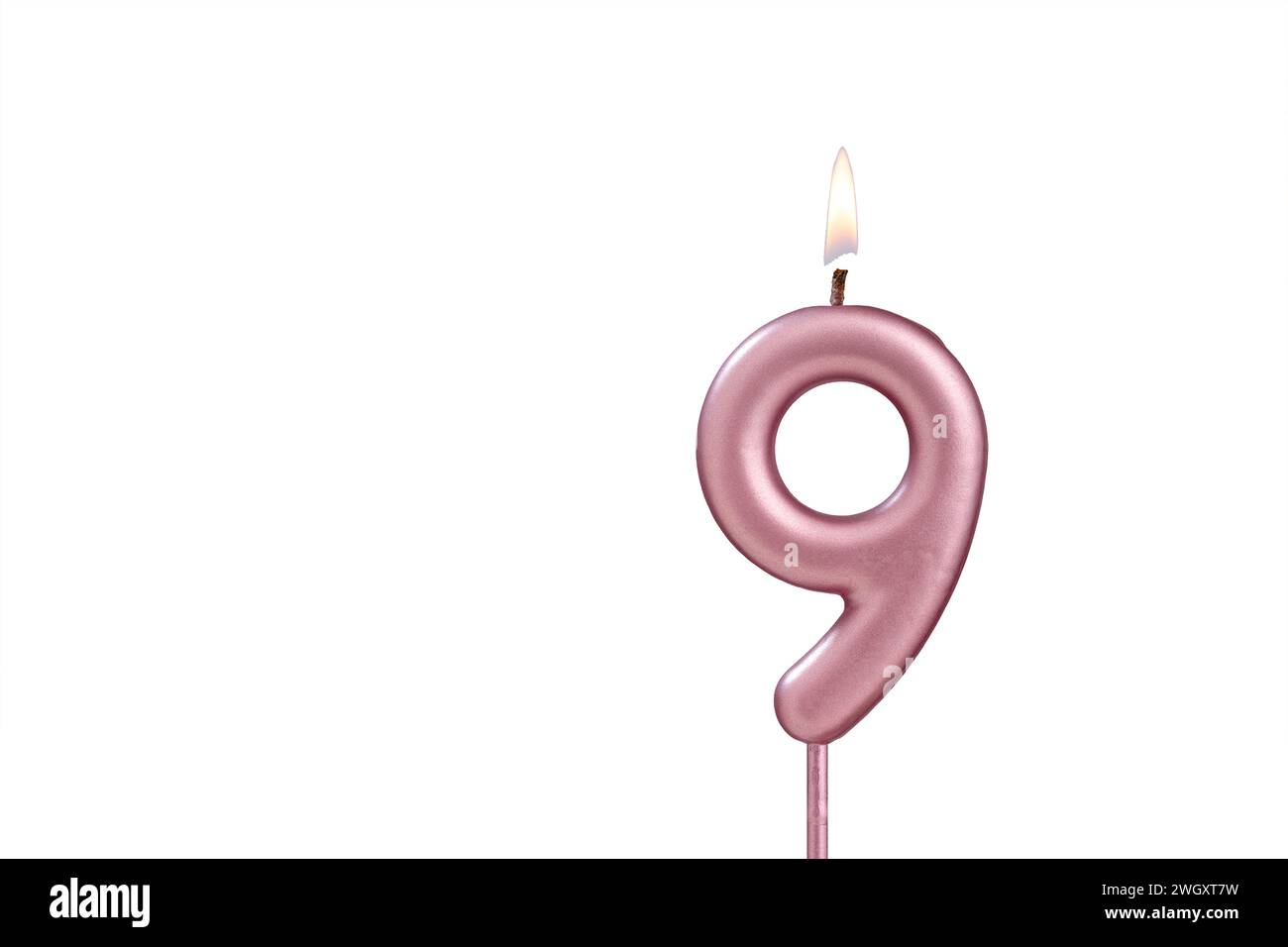 Candle number 9 - Lit birthday candle on white background Stock Photo ...