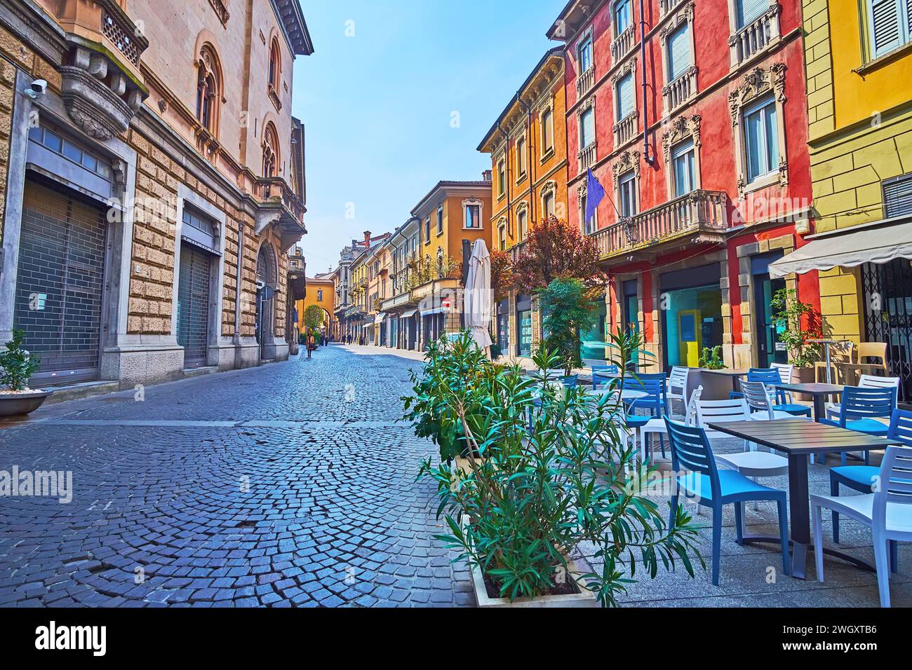 Historic houses line the narrow Corso Umberto I street, located in old ...