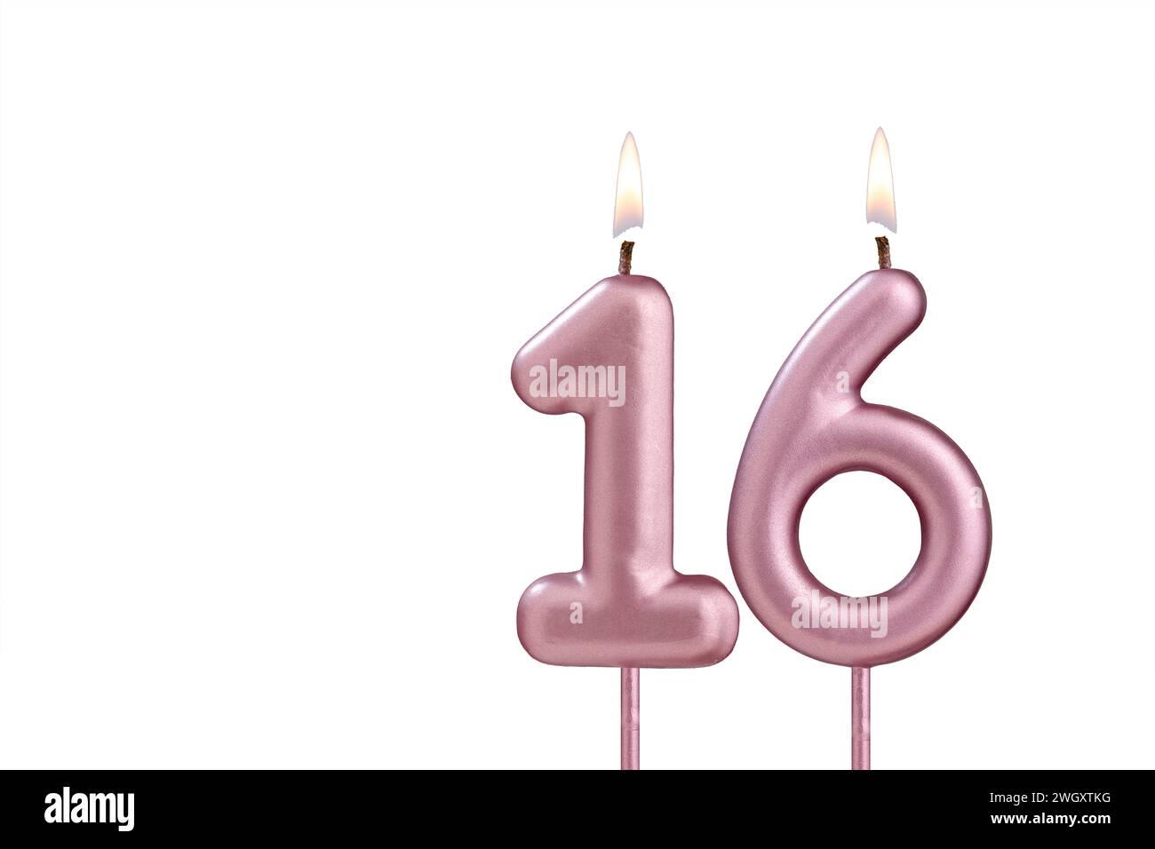 Lit birthday candle - Candle number 16 on white background Stock Photo ...