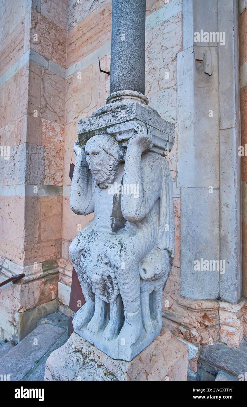 The ancient sculptured stone column base at the entrance of Piacenza ...