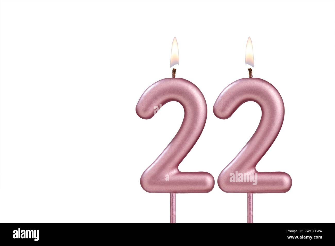 Lit birthday candle - Candle number 22 on white background Stock Photo ...