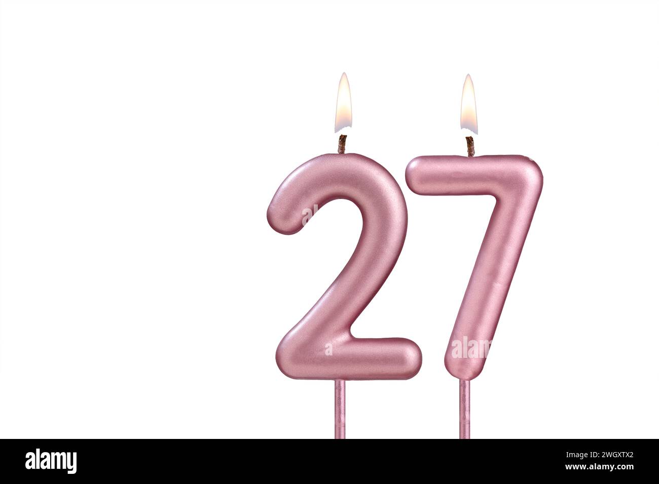Candle number 27 - Lit birthday candle on white background Stock Photo ...