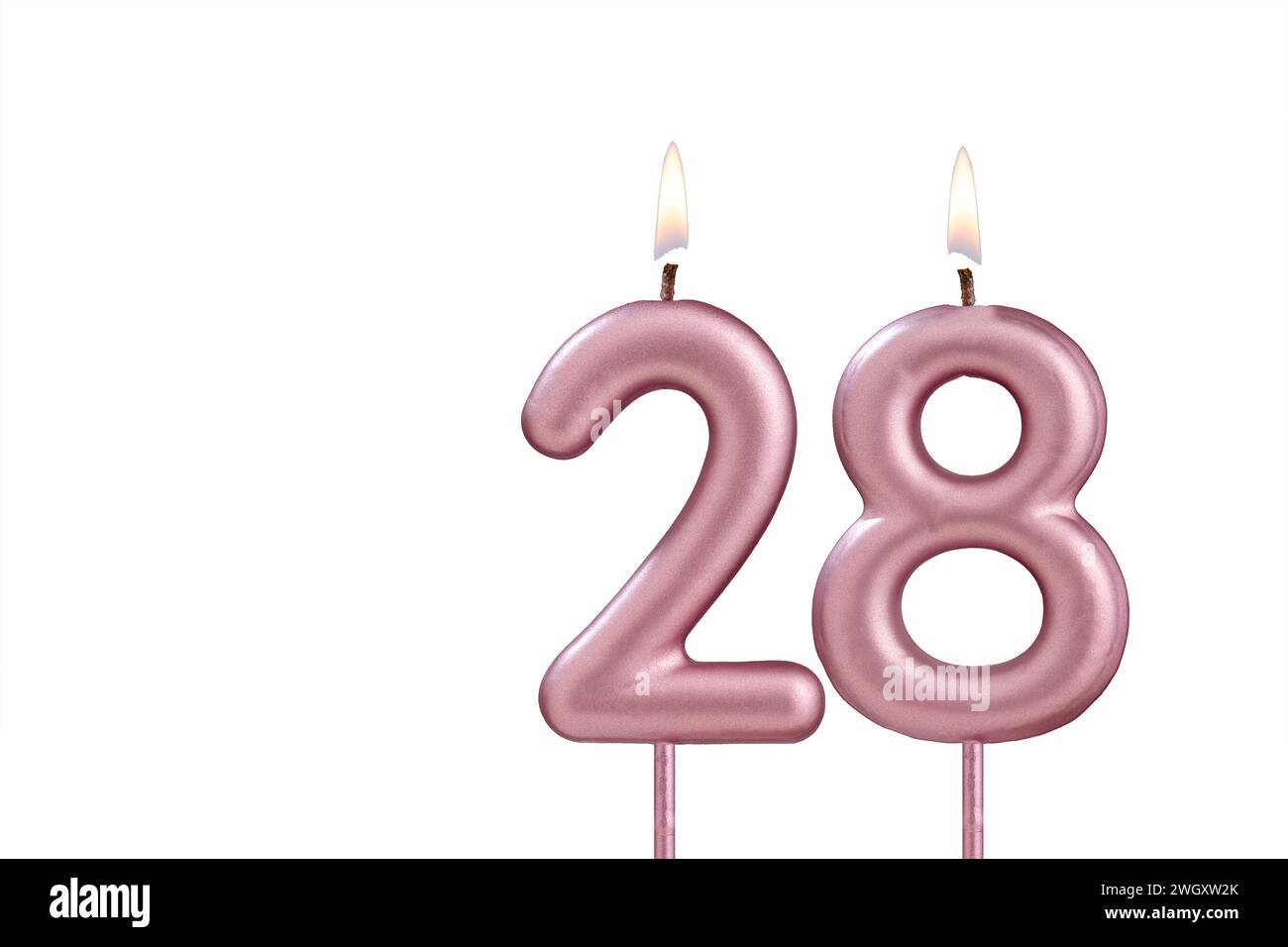 Lit birthday candle - Candle number 28 on white background Stock Photo ...