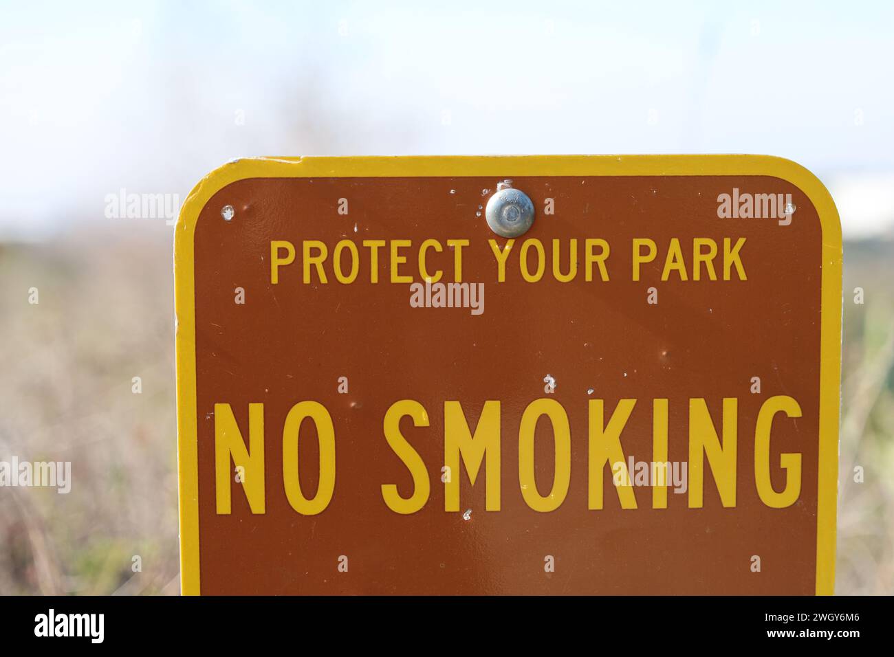 Outdoor park informative park sign for no smoking Stock Photo - Alamy