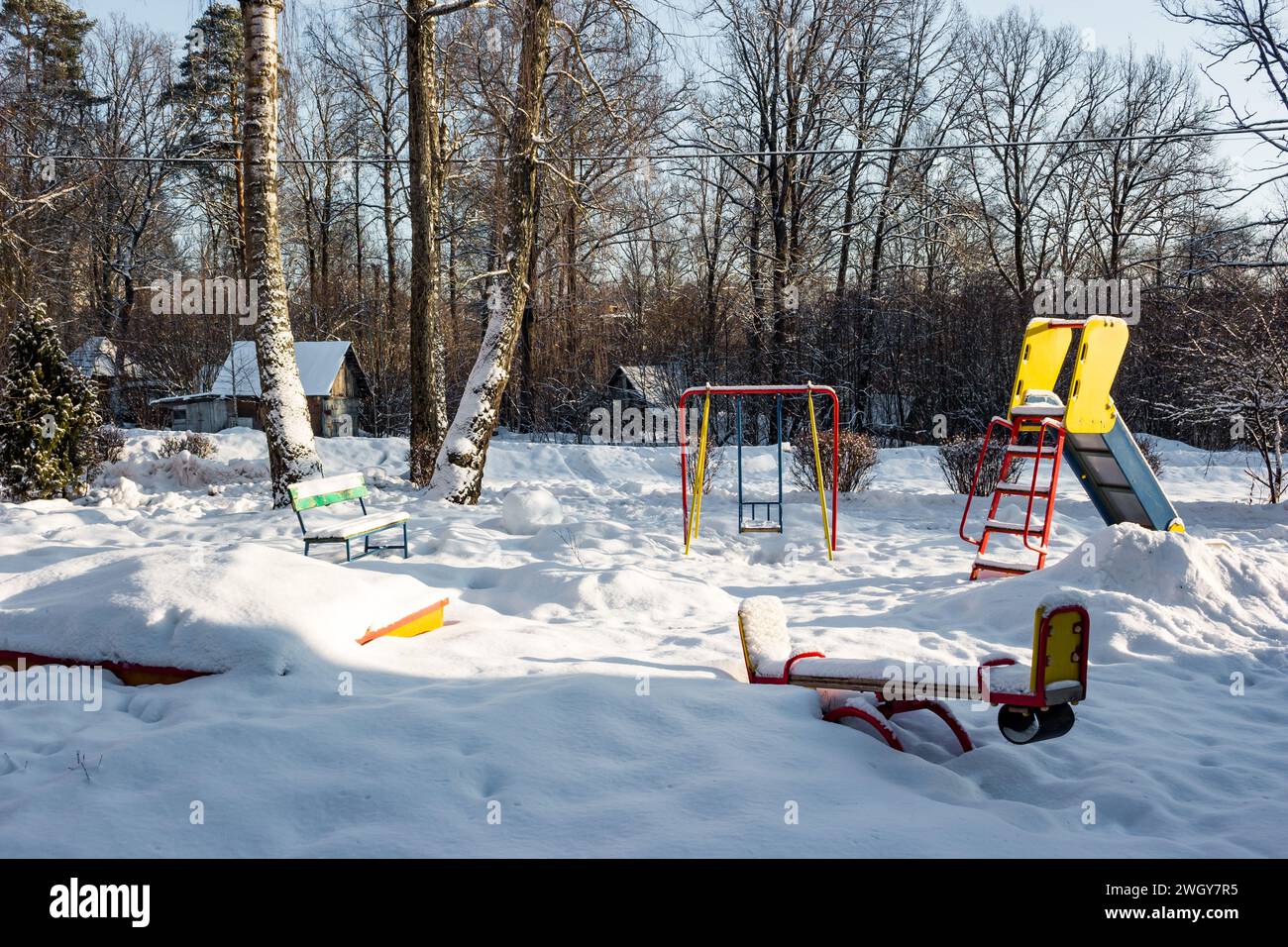 Snowy winter children's playground in the yard in the countryside Stock ...
