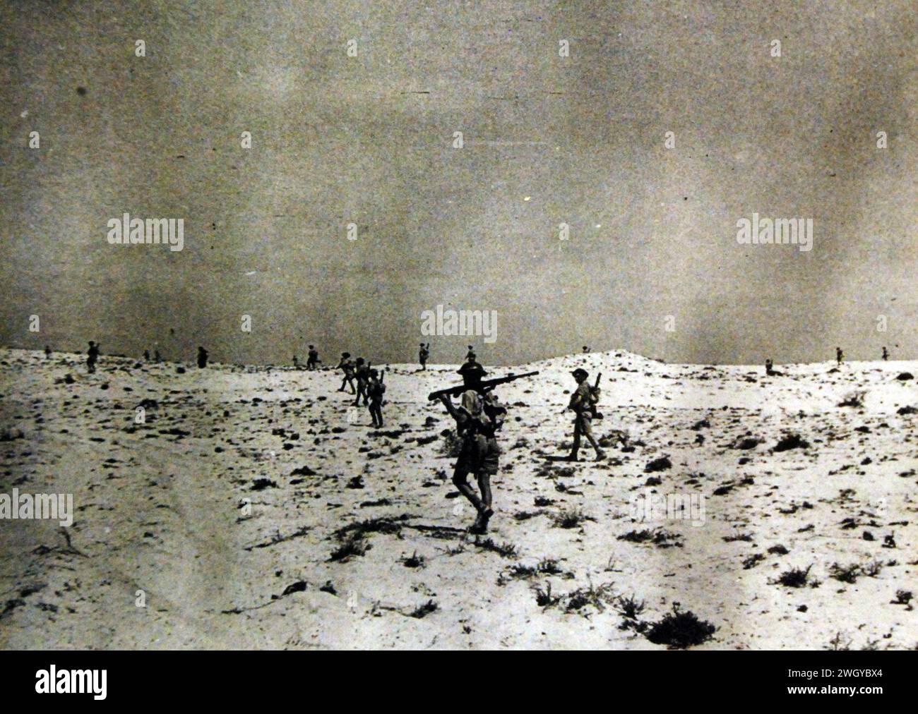 Australian infantry advancing over the sand-dunes in western desert in ...