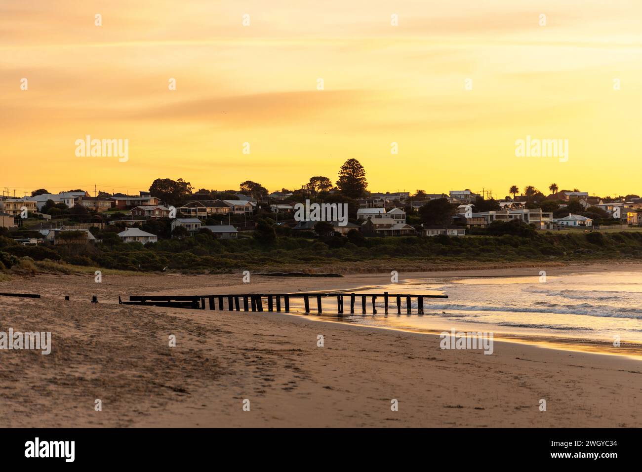 A Victor Harbor beach sunrise with the holiday houses and erosion ...