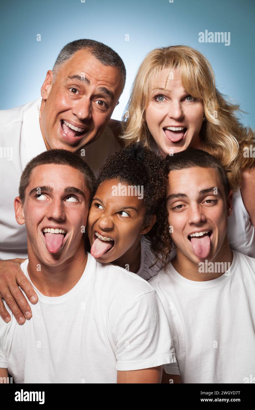 Studio family portrait making faces Stock Photo - Alamy