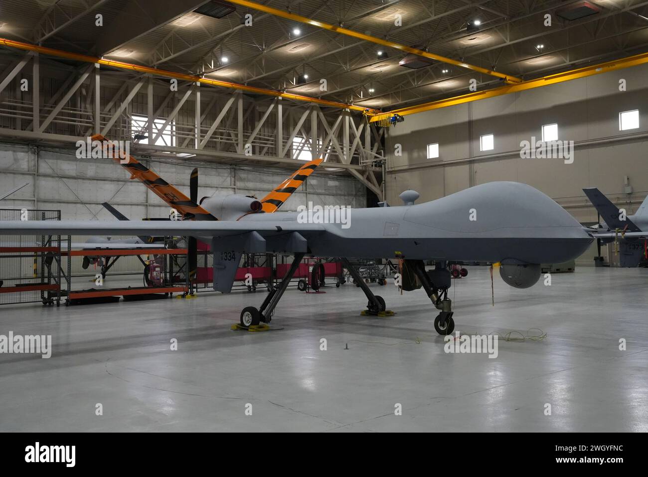 An MQ-9 Reaper remotely piloted aircraft is parked in a hangar at ...