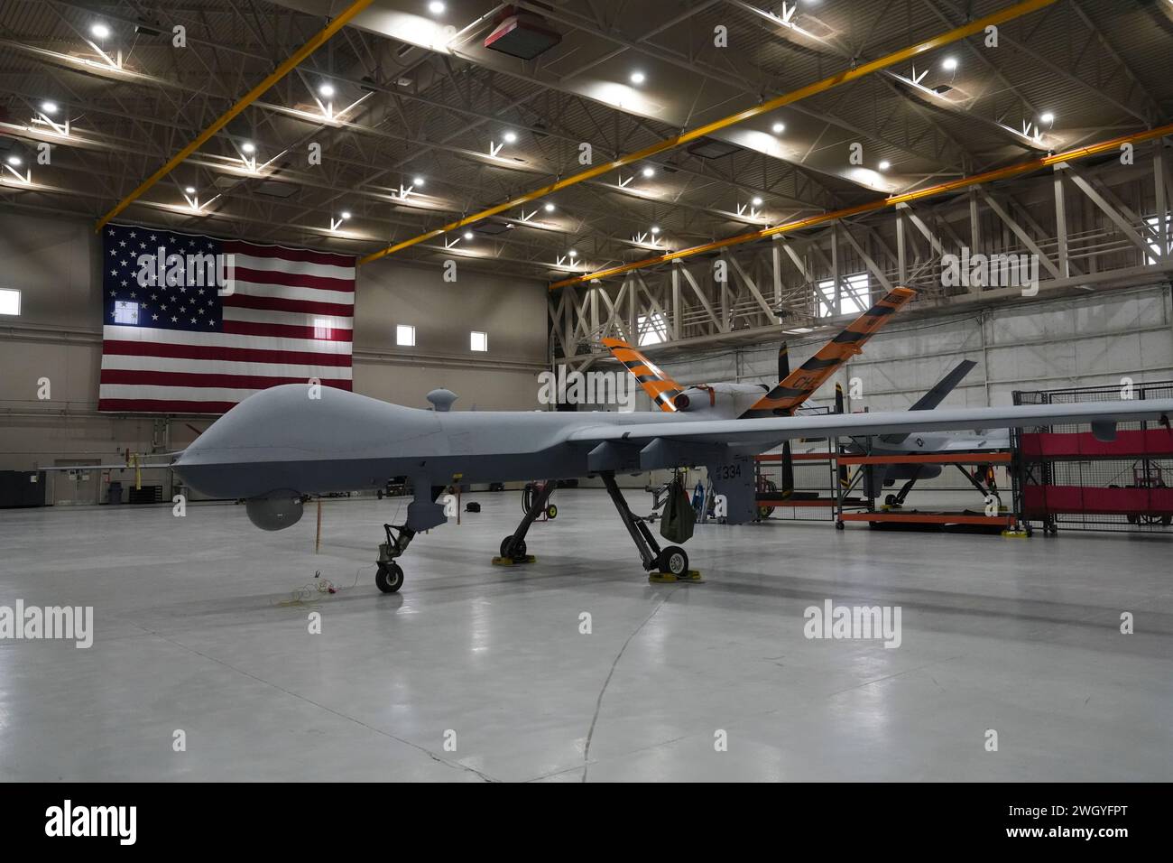 An MQ-9 Reaper remotely piloted aircraft is parked in a hangar at ...