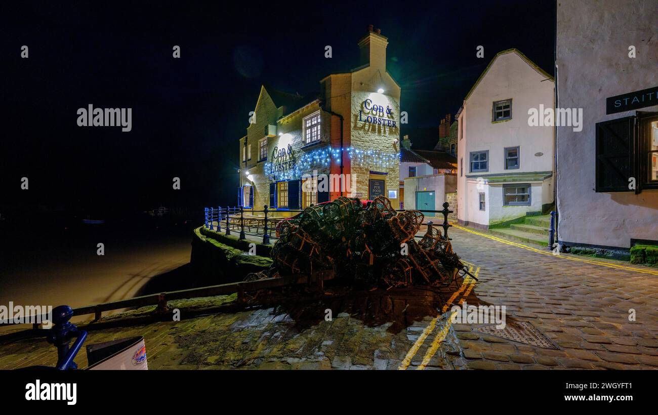 Staithes, UK - December 18, 2023: Staithes High Street, night time shot ...