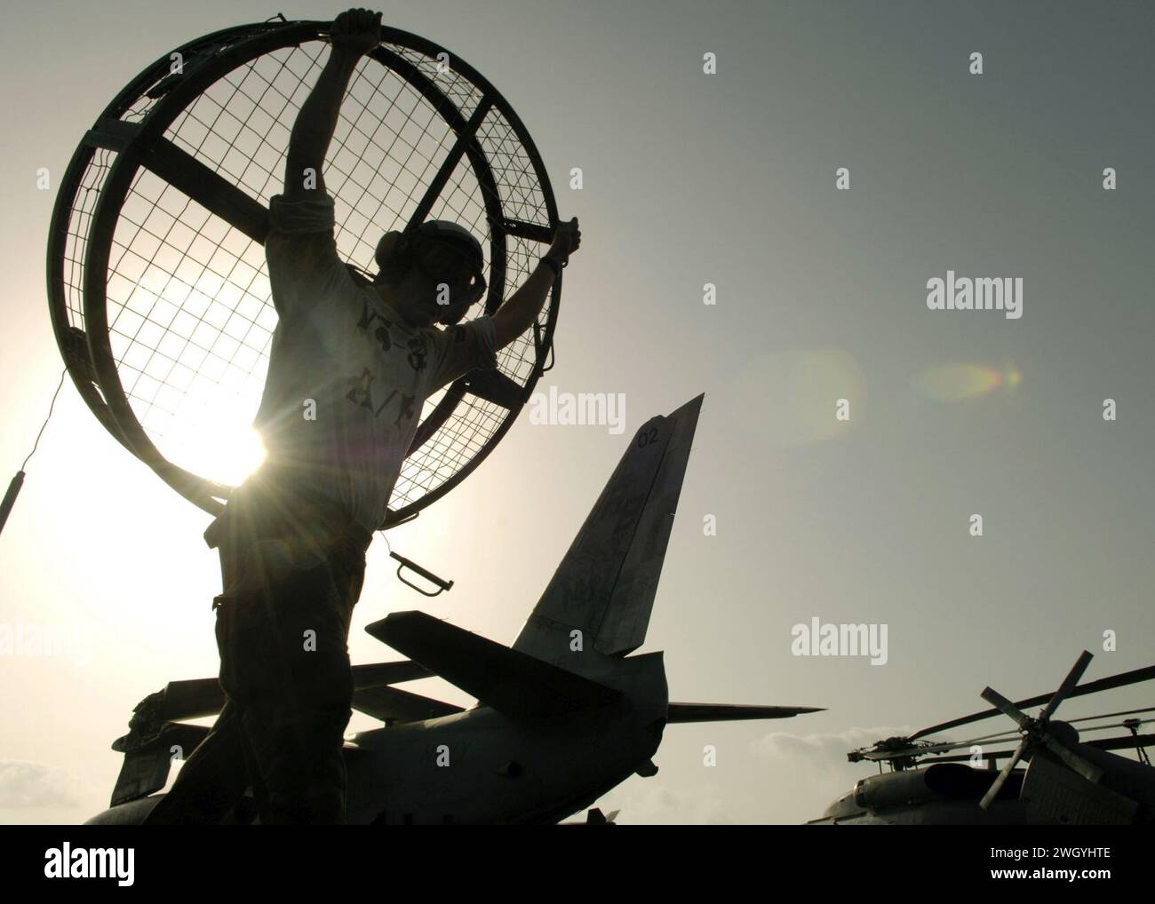Aviation Structural Mechanic carrying S-3B Viking engine intake screen ...