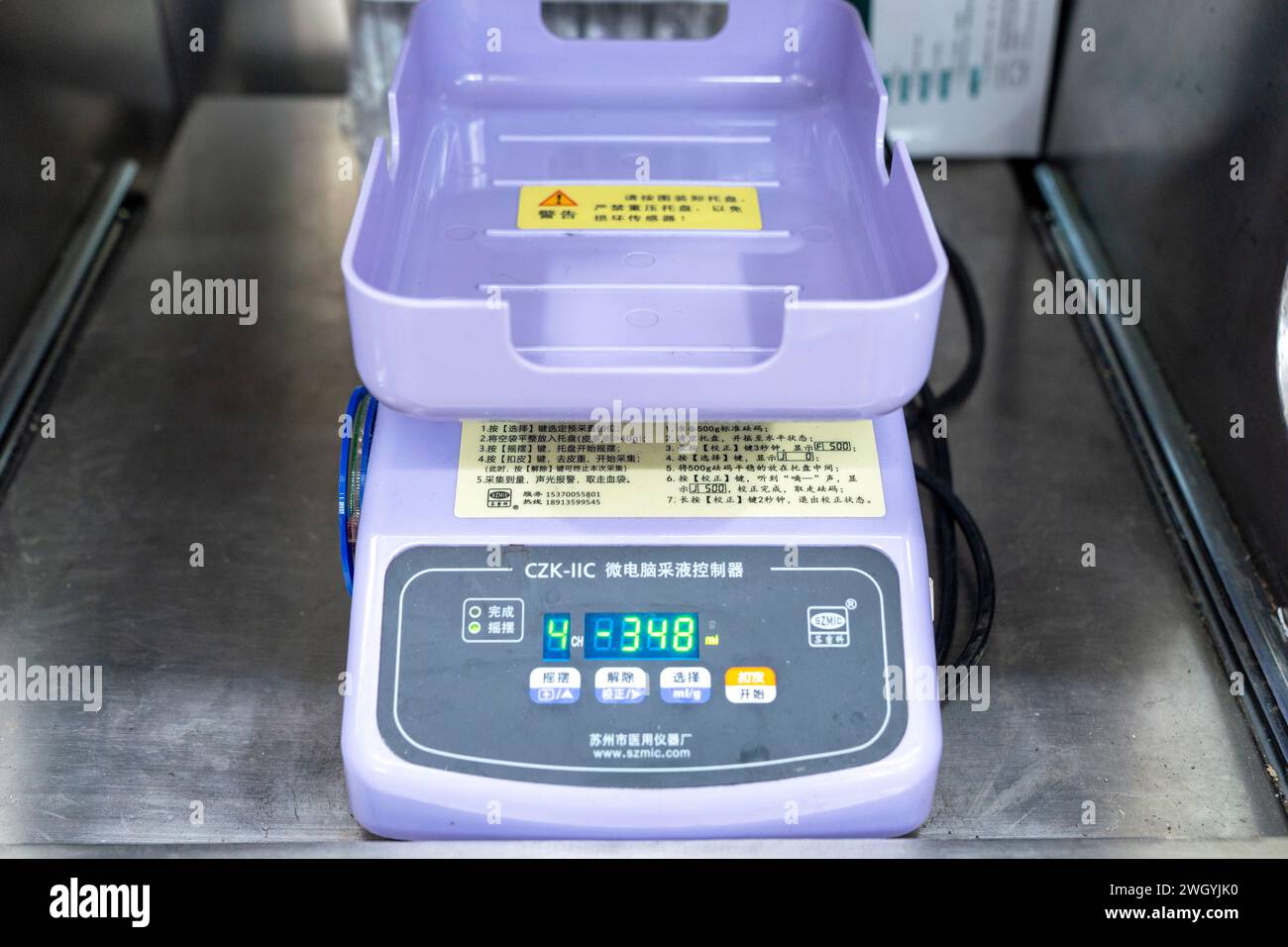 ENSHI, CHINA - FEBRUARY 1, 2024 - An electronic blood collection scale ...