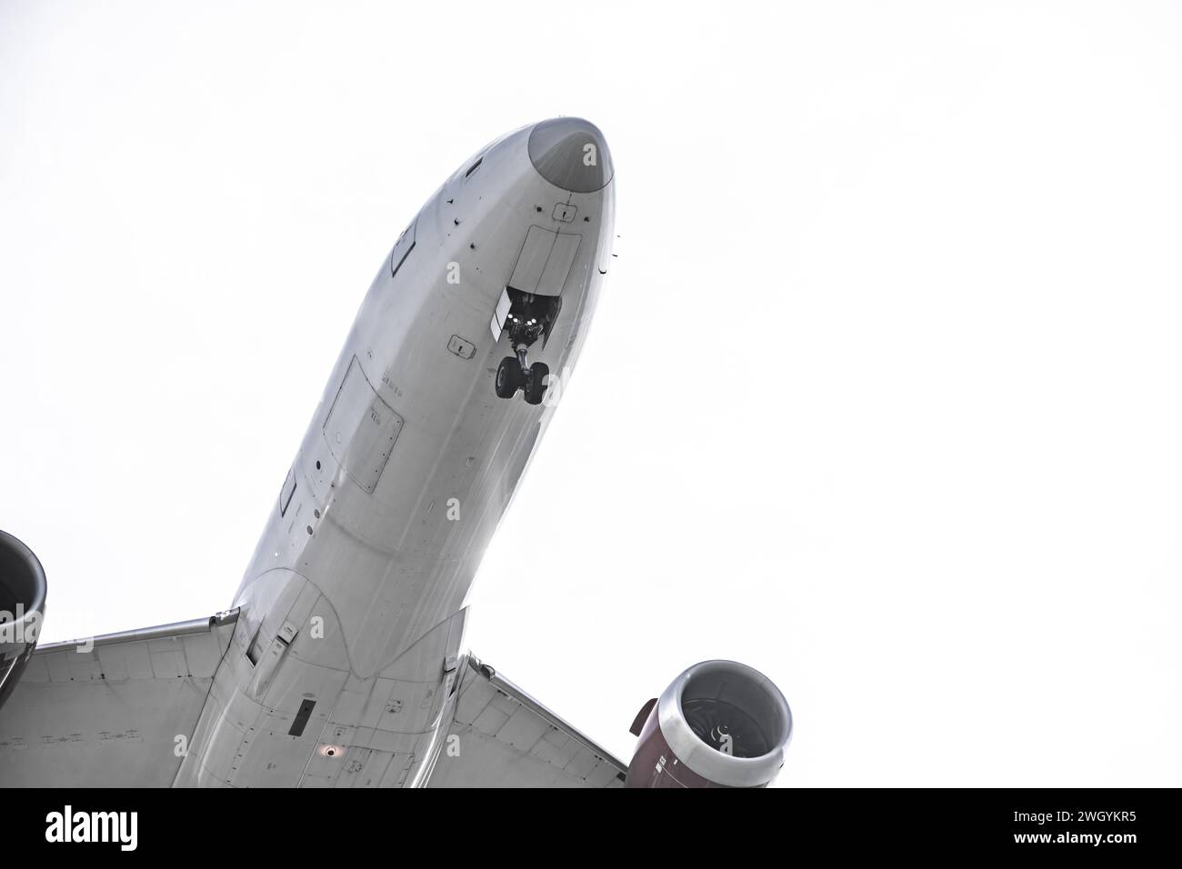 Nose fuselage of a low flying passenger plane Stock Photo - Alamy
