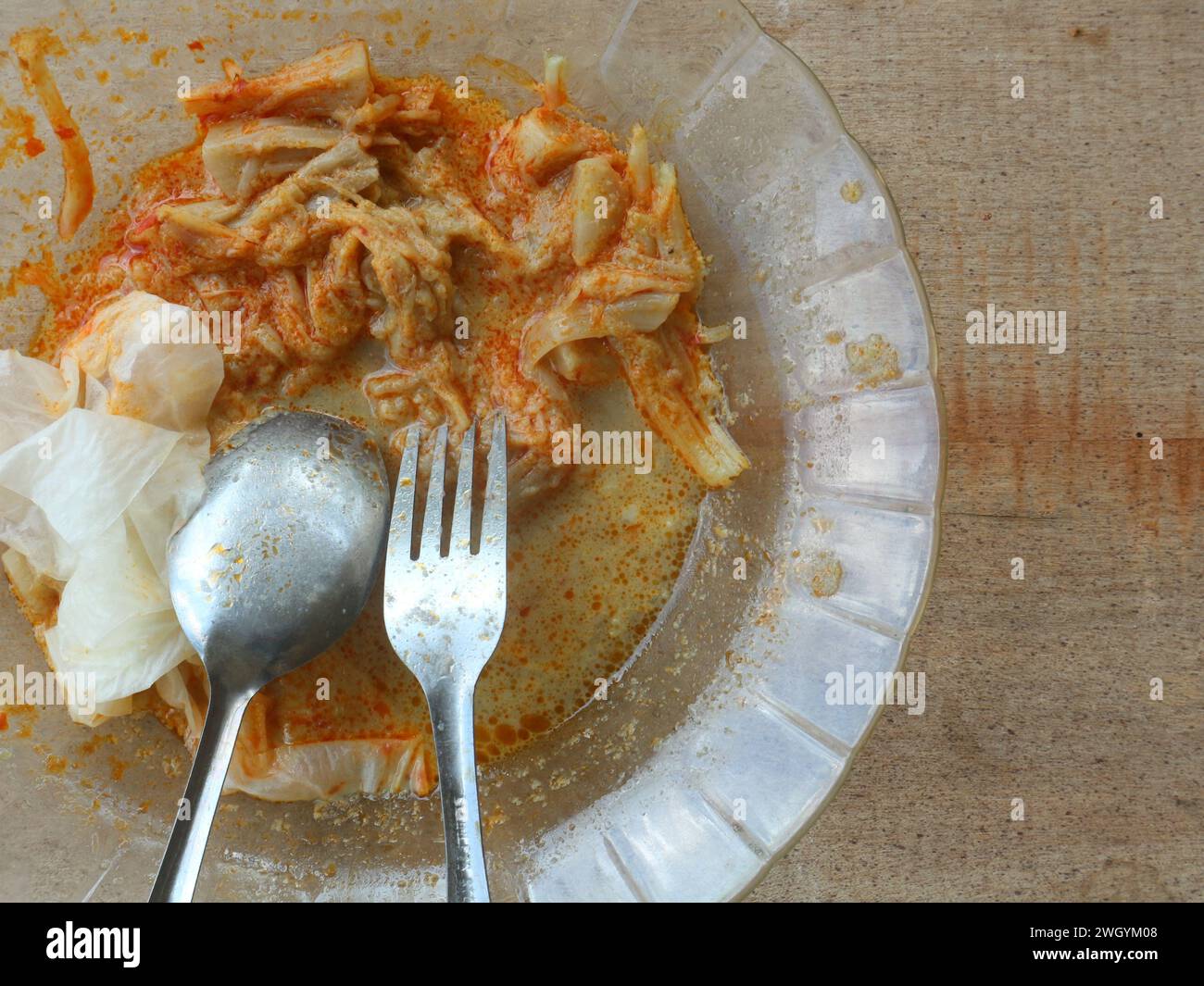 Leftover plate of rice cake with coconut milk sauce Stock Photo - Alamy