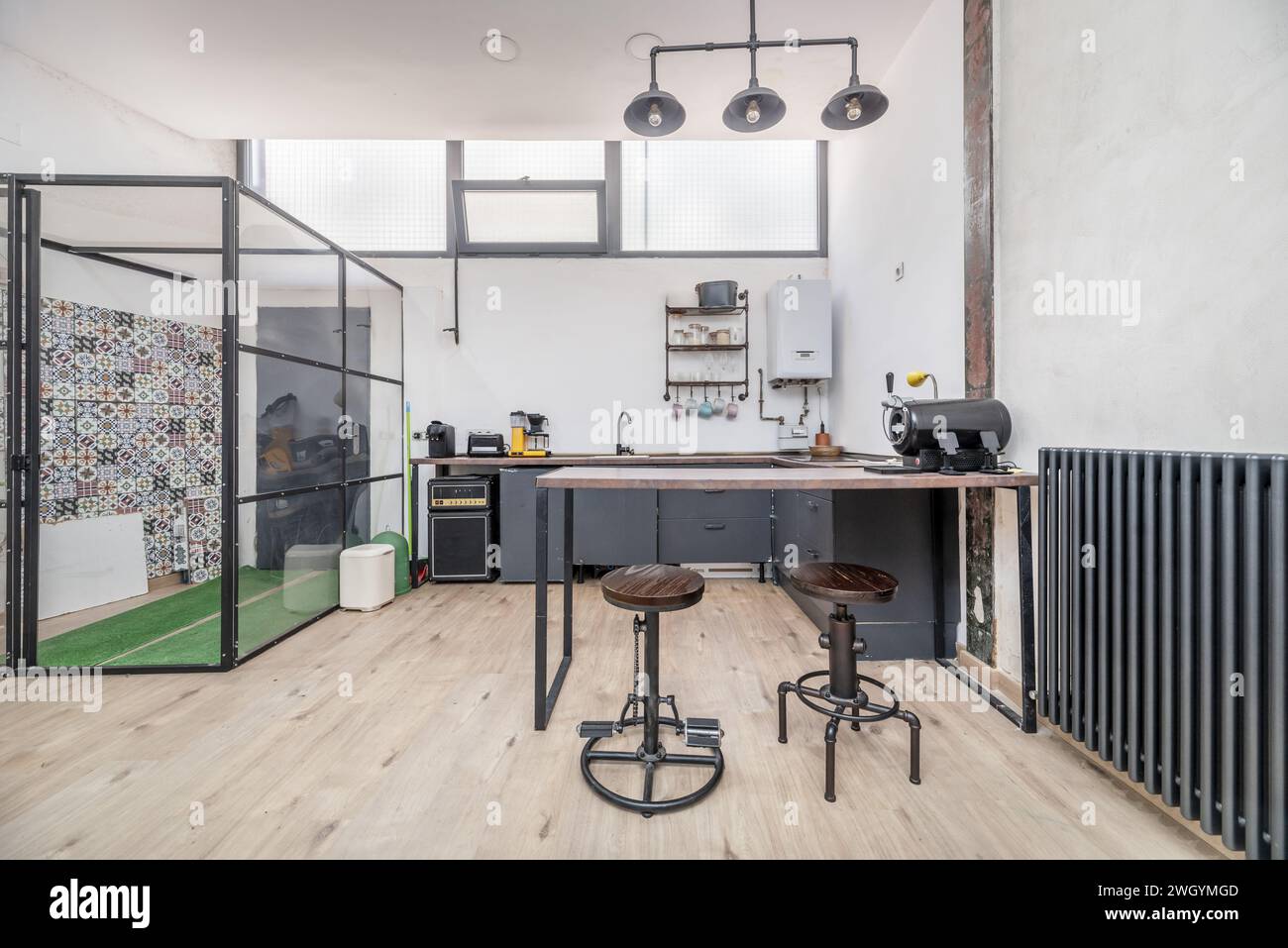 Small kitchen with gray furniture in a loft-style home with high ...