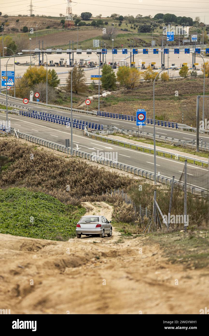 A vehicle driver fooling around in a muddy patch on the side of a ...