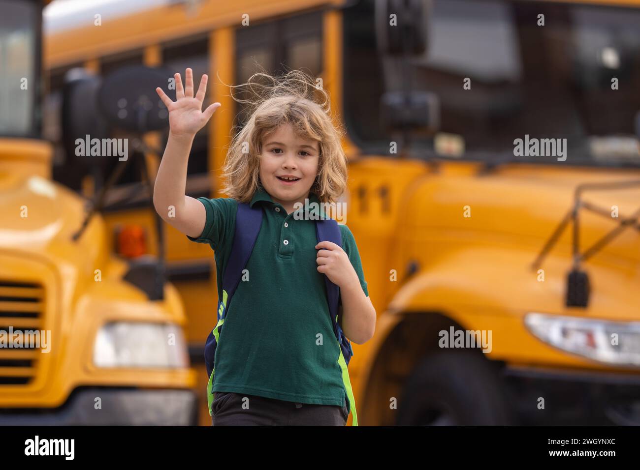 Education concept. Schoolboy getting on the school bus. American School ...