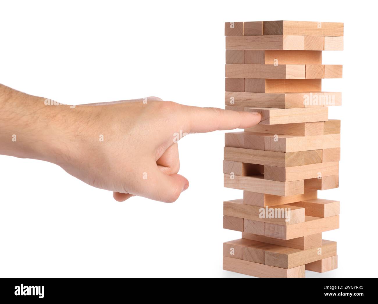 Playing Jenga. Man building tower with wooden blocks on white ...