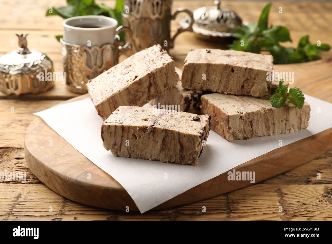 Tasty chocolate halva with mint on wooden table, closeup Stock Photo - Alamy