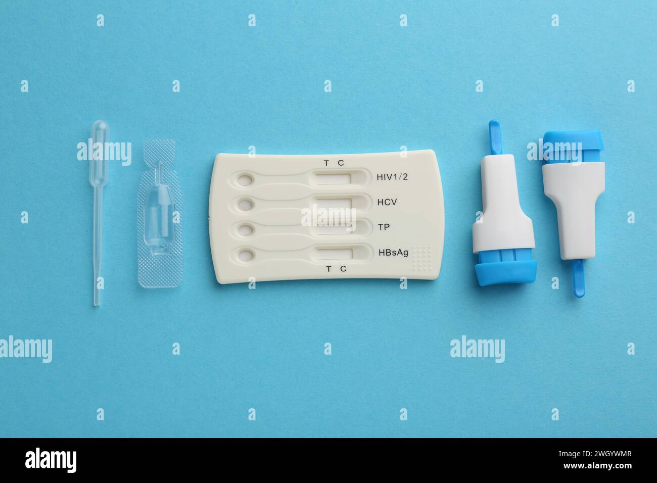Disposable multi-infection express test kit on light blue background ...