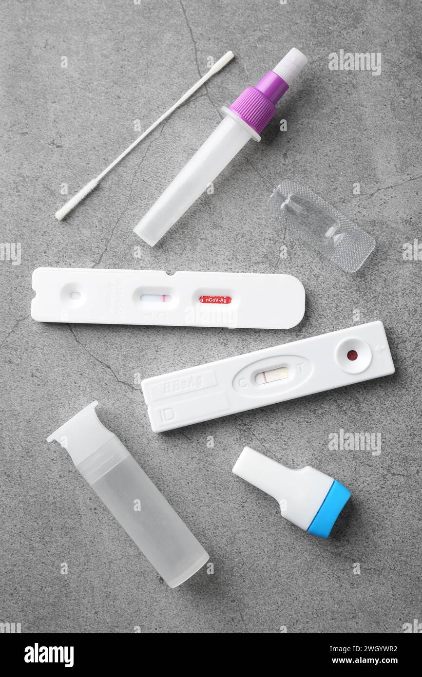 Disposable express test kits on grey table, flat lay Stock Photo - Alamy