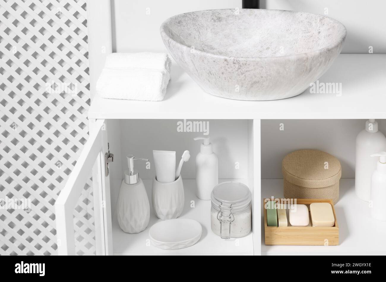 Different personal care products and bath accessories in bathroom ...