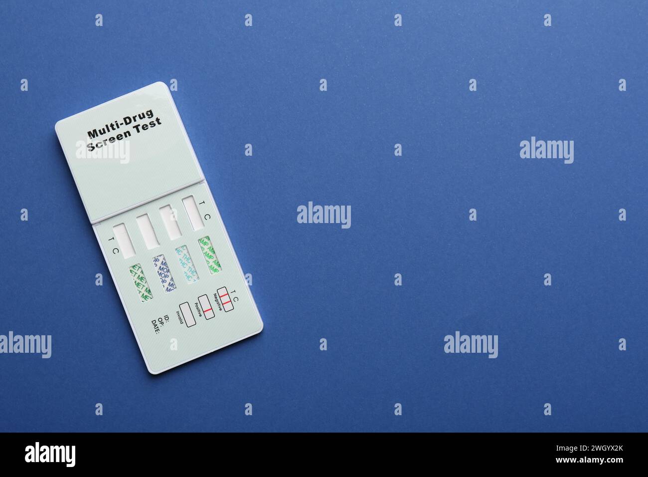 Multi-drug screen test on blue background, top view. Space for text ...