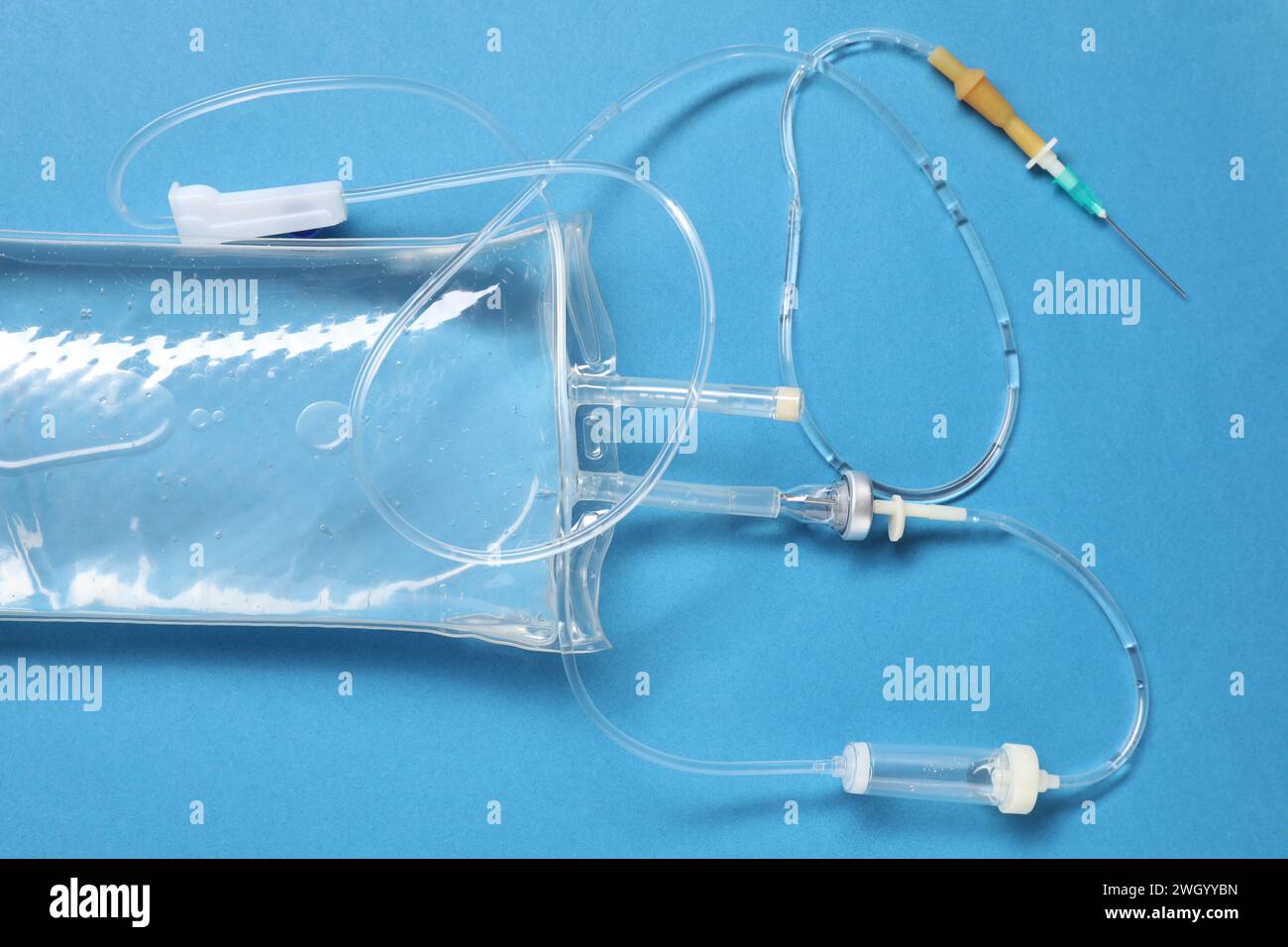 IV infusion set on light blue background, top view Stock Photo - Alamy