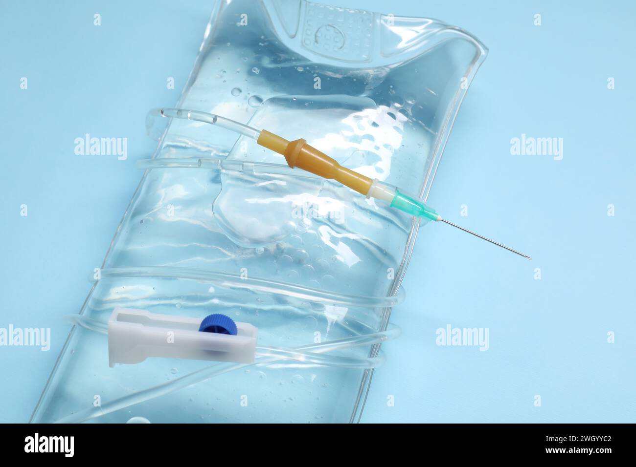 IV infusion set on light blue background, closeup Stock Photo - Alamy