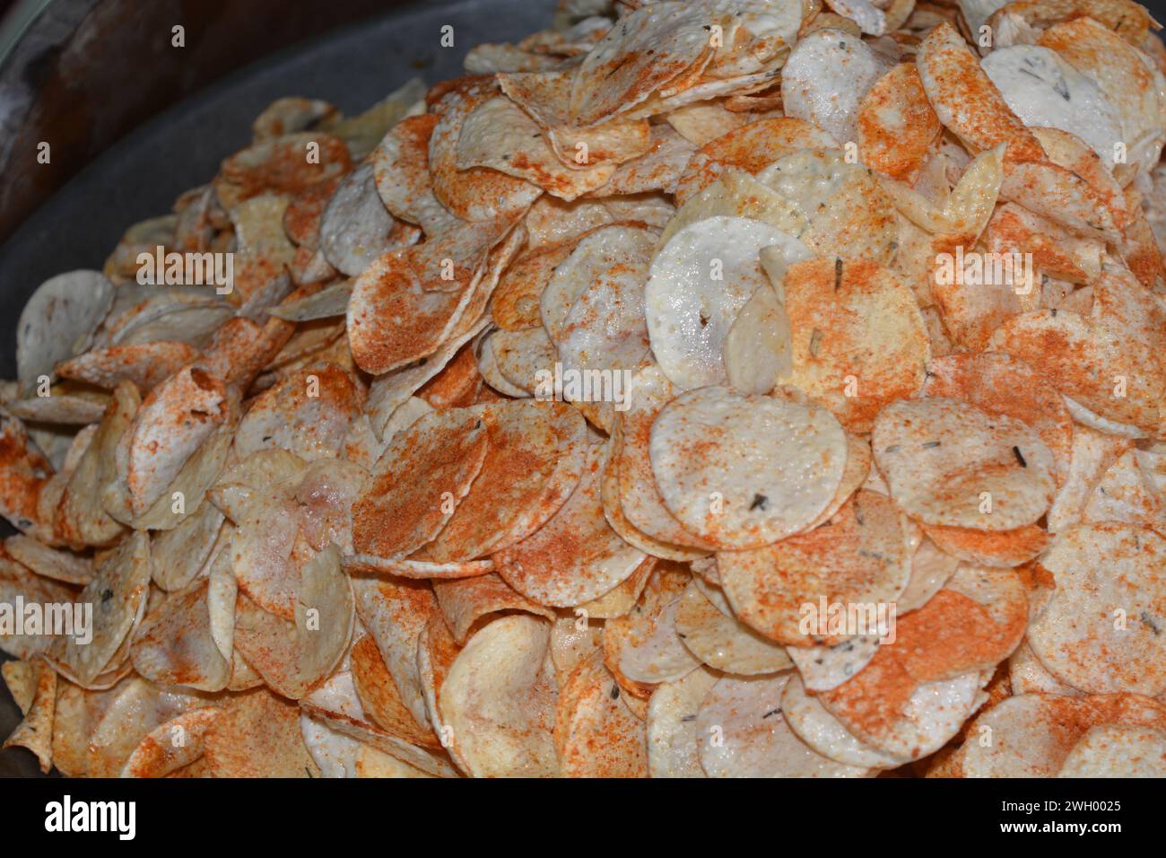 A woman who is frying cracker snacks Stock Photo - Alamy