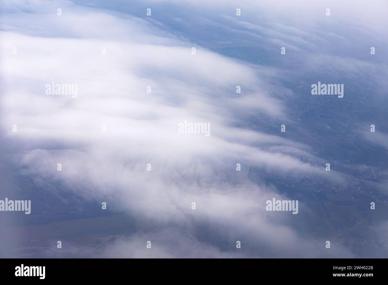 Viewing clouds in the sky through the window of an aircraft Stock Photo ...