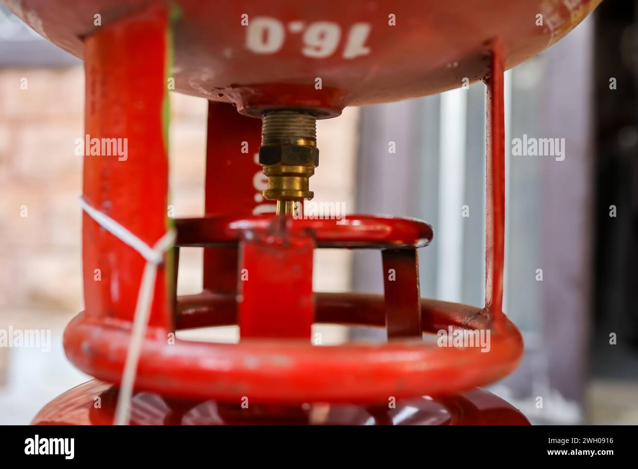 Liquefied Petroleum Gas cylinder refilling through valve close up at ...