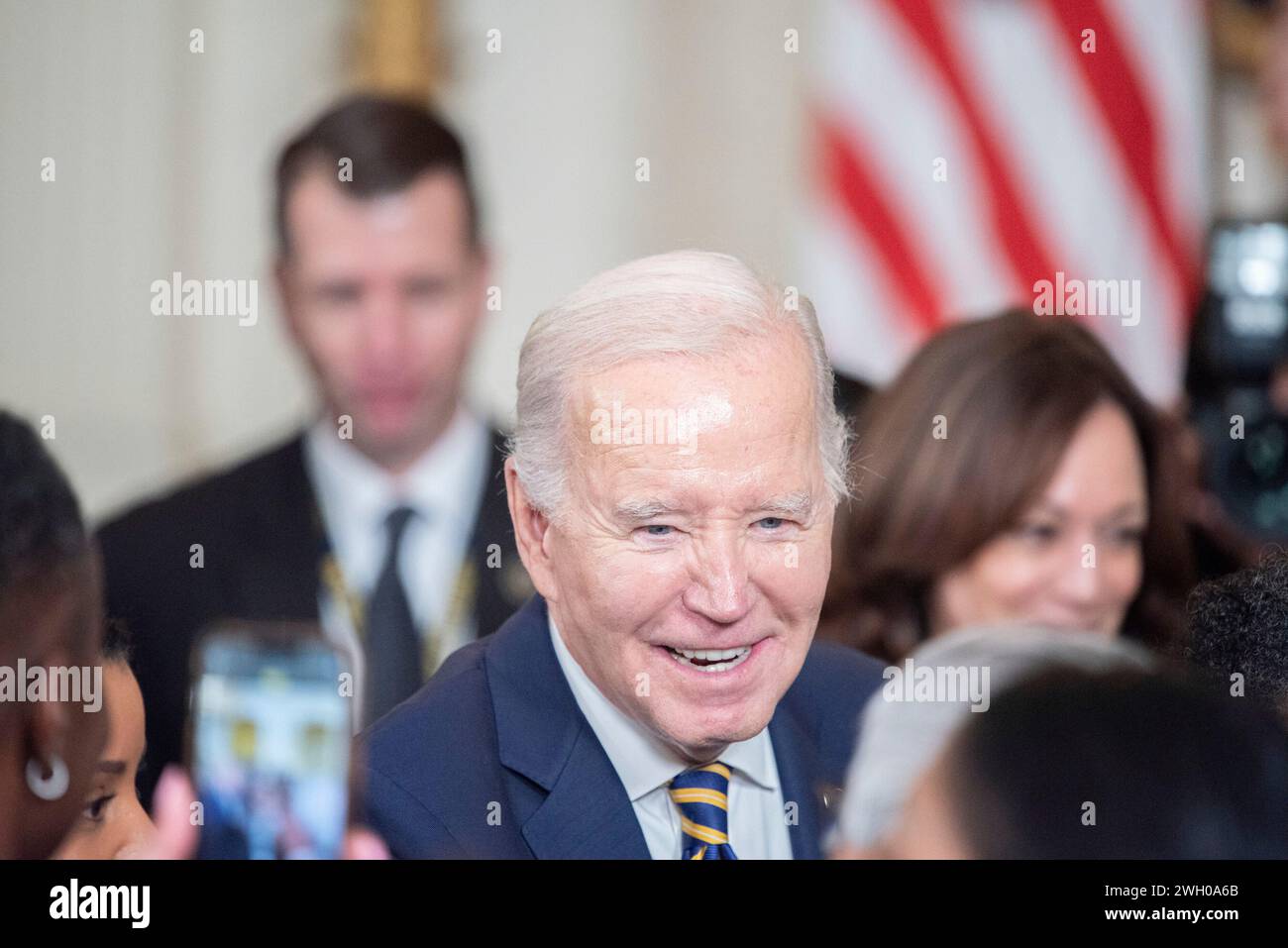 United States President Joe Biden takes photos with the crowd after his ...