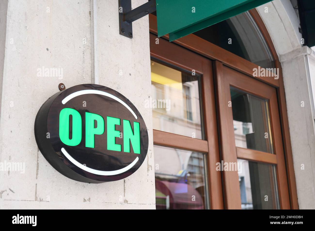 Open sign hanging front of cafe Stock Photo - Alamy