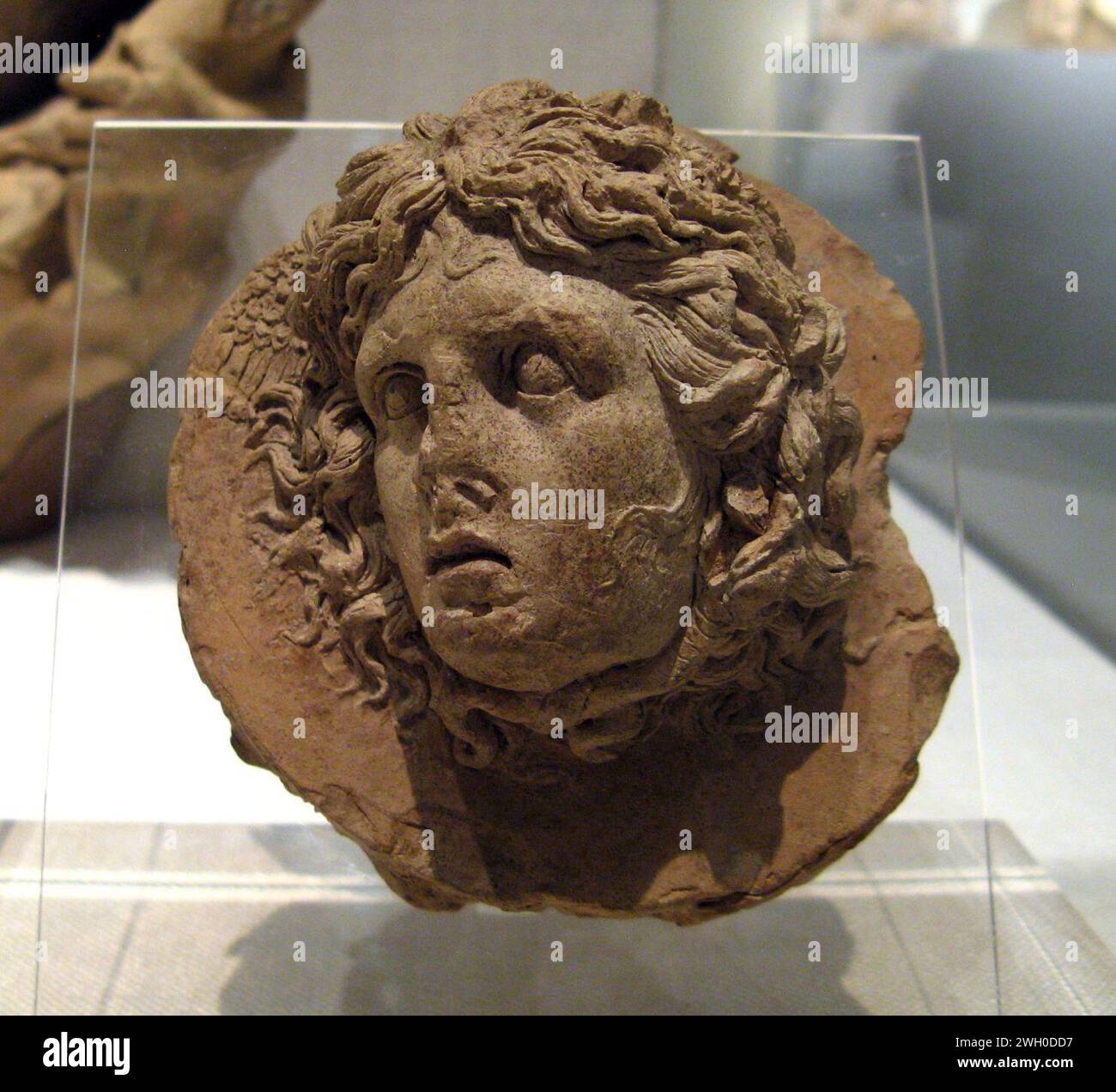 Terracotta relief medallion with Gorgoneion Stock Photo - Alamy