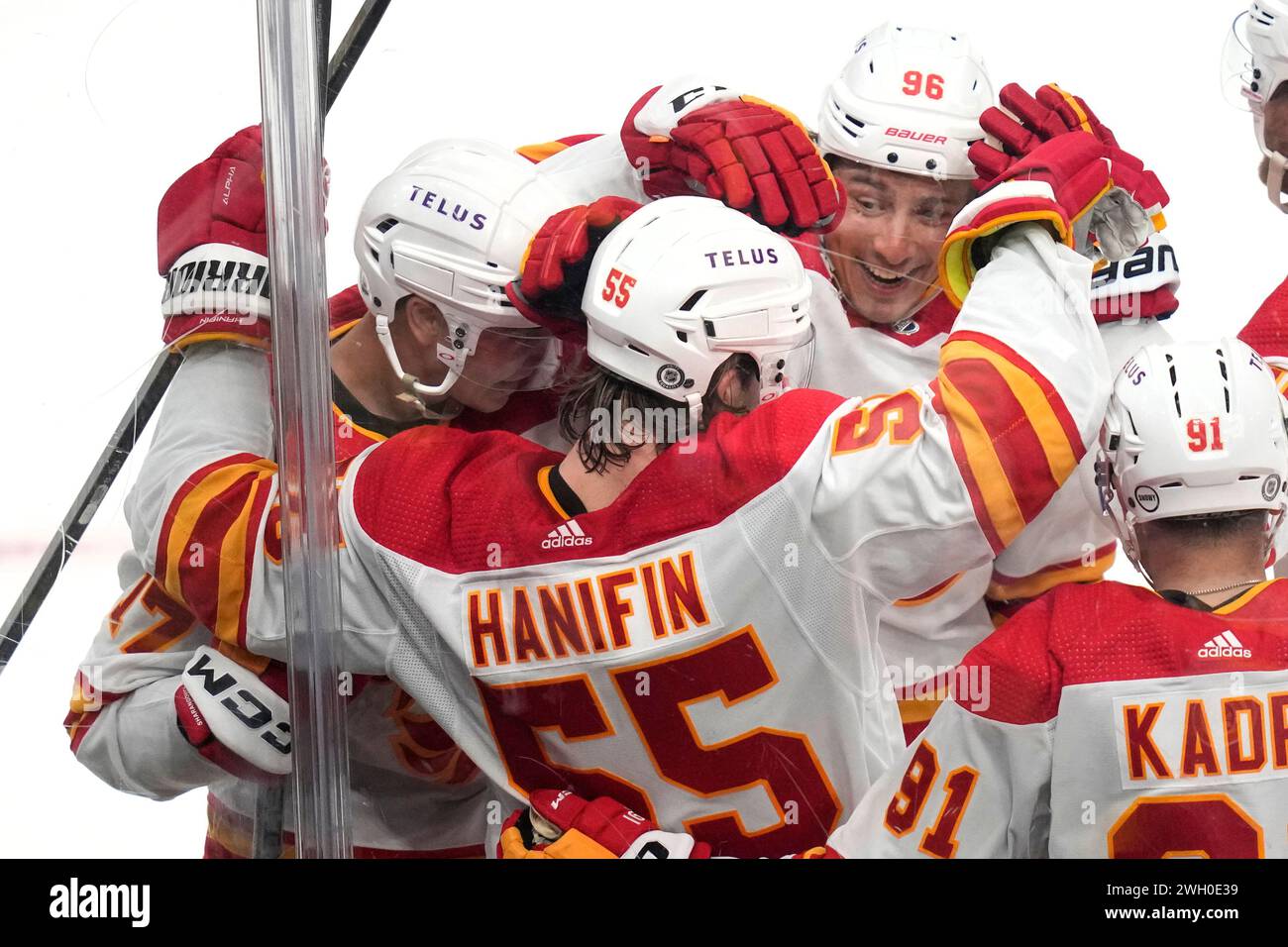 Calgary Flames defenseman Noah Hanifin (55) is congratulated by ...