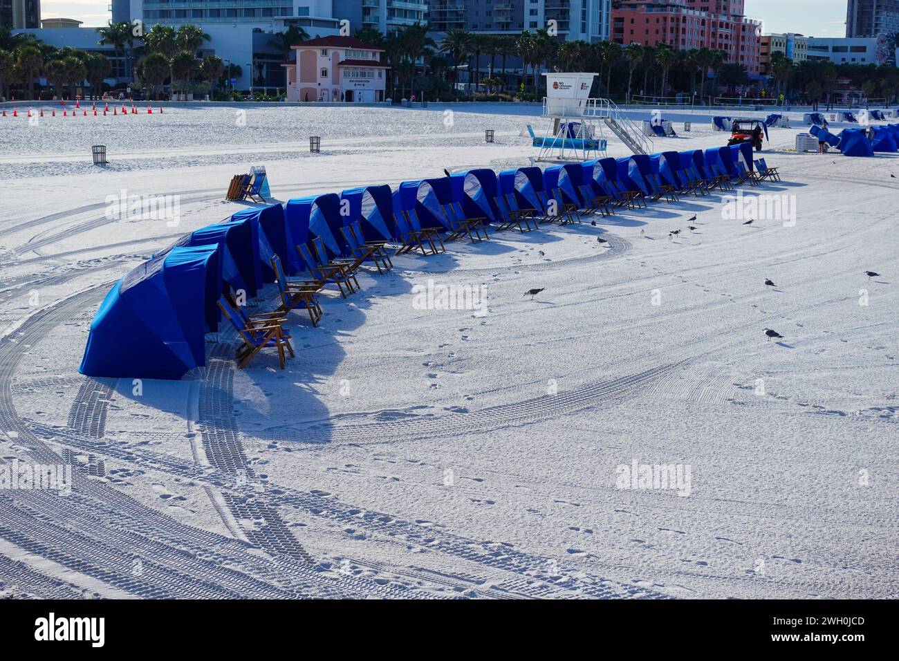 Row of beach blue canopies shading white sand beach in Florida Stock ...
