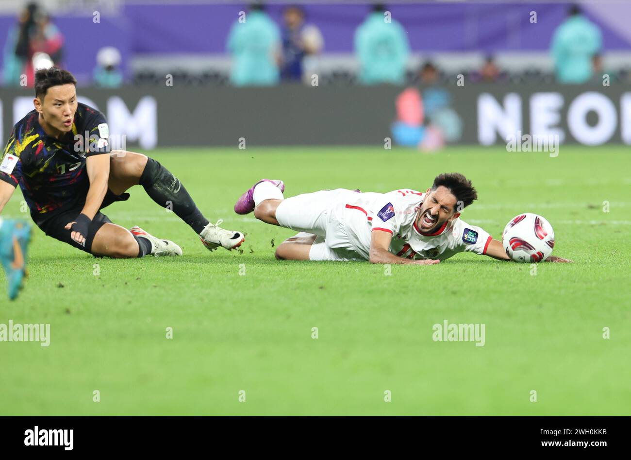Al Rayyan, Qatar. 6th Feb, 2024. Jordan's Yazan Alnaimat (R) falls ...