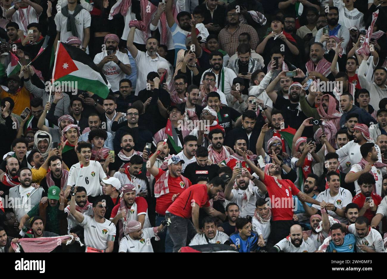 Al Rayyan, Qatar. 6th Feb, 2024. Fans of Jordan celebrate a goal during ...