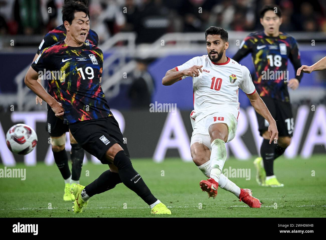 Al Rayyan, Qatar. 6th Feb, 2024. Jordan's Mousa Altamari (front R) shoots and scores during the ...
