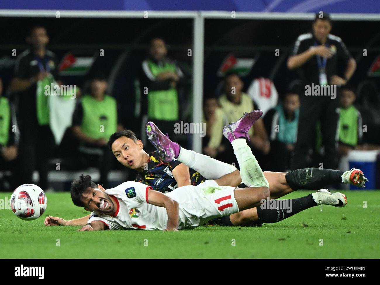 Al Rayyan, Qatar. 6th Feb, 2024. South Korea's Jung Seunghyun (rear ...