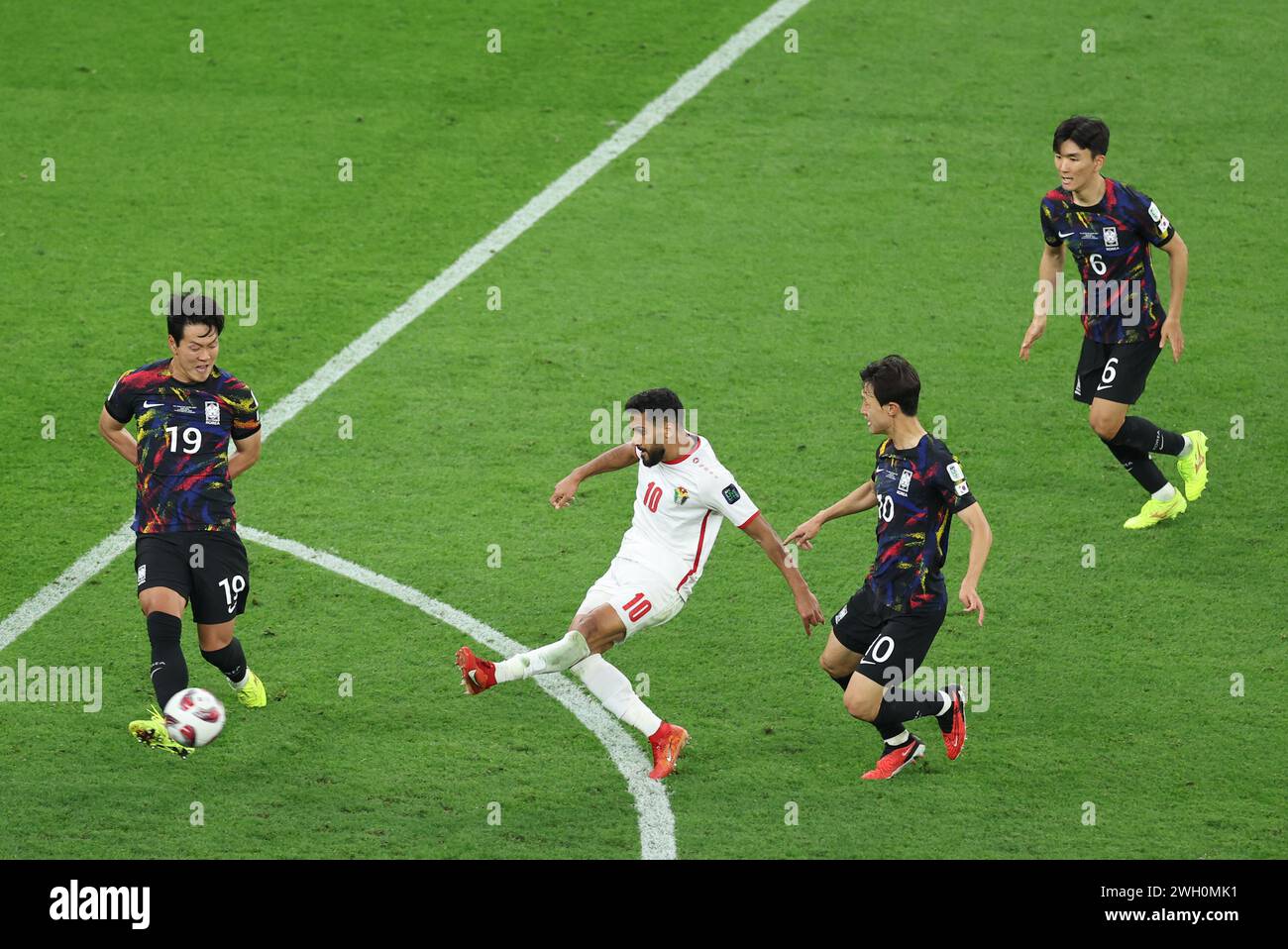 Al Rayyan, Qatar. 6th Feb, 2024. Jordan's Mousa Altamari (2nd L) shoots ...